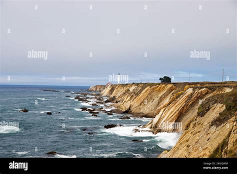 View Of Point Arena Lighthouse On A Rocky Seashore In California By