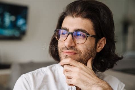 Close Up Of A Pensive Mid Aged Brunette Turkish Man Face Wearing White
