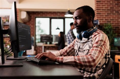 Free Photo Freelance Coder Typing Javascript Code On Computer To