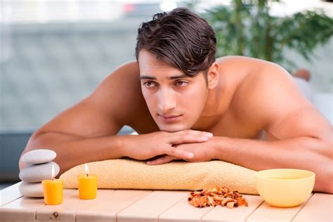 Premium Photo Handsome Man During Spa Massaging Session