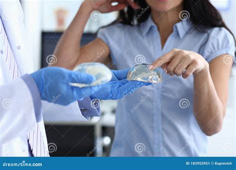 Girl In Clinic Touches Silicone Breast Implant Stock Image Image Of