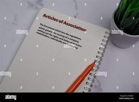 Definition Of Articles Of Association Word With A Meaning On A Book Dictionary Concept Stock