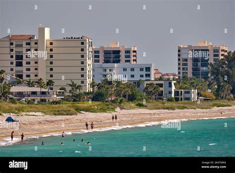 Resort Beach With White Sand Blue Water Tall Hotel Buildings Happy