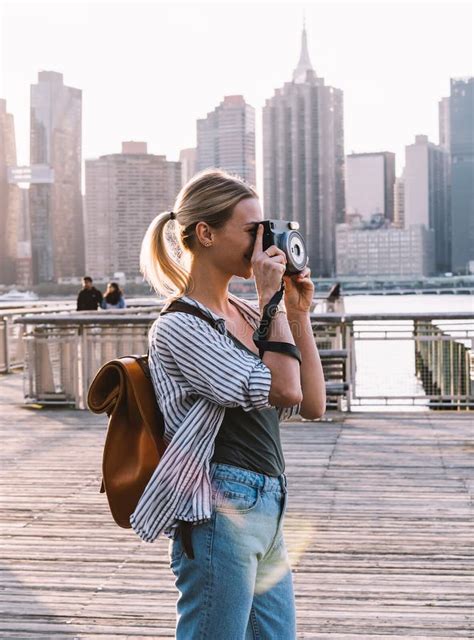 Skilled Female Traveller Testing Camera Equipment During Journey Trip