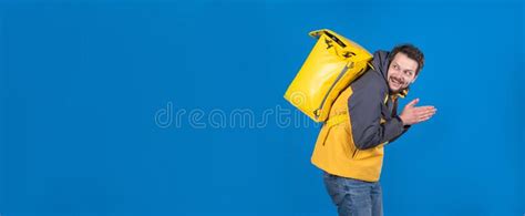 Emotional Food Delivery Guy With Grin On His Face In Yellow Uniform And