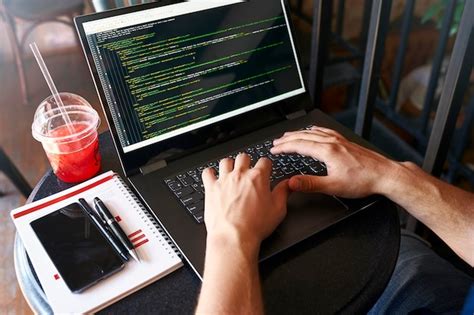 Premium Photo Developer Programmer With Laptop Program Code And Script Data On Screen Young