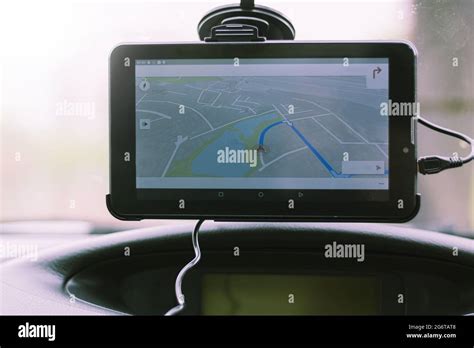 Navigator On The Windshield Of The Car Gps Navigation Device In The