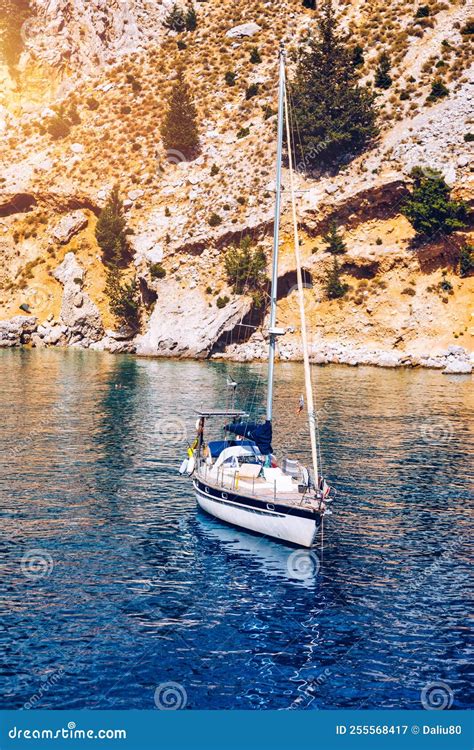 Yacht Anchoring In Crystal Clear Turquoise Water In Front Of The