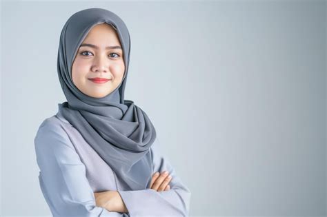 Cheerful Malay Woman Wearing Hijab With Crossed Arms Premium Ai