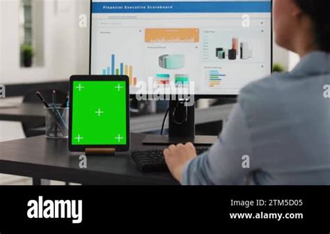 Specialist Works With Greenscreen Tablet In Open Floor Plan Office Presenting Isolated Display