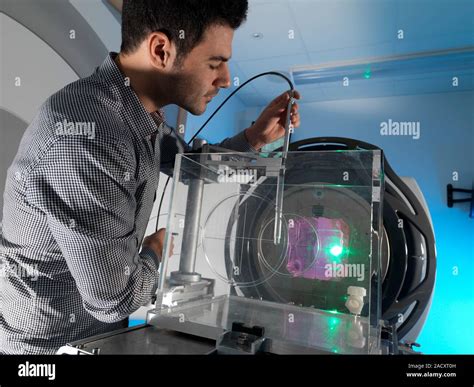 Radiotherapy Calibration Scientist Setting Up Equipment Used To