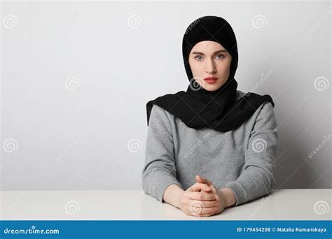 Portrait Of A Muslim Woman Wearing A Head Scarf Hijab And Looking At