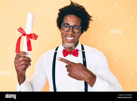 Handsome African American Nerd Man With Afro Hair Holding Graduate Degree Diploma Smiling Happy