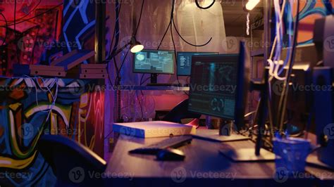Dolly Out Shot Of Empty Messy Hackers Base Of Operations With Neon