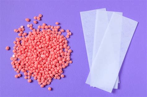 Premium Photo Pink Granules Of Wax For Depilation And Depilatory