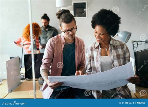 Engineers Are Helping To Design Work On Blueprints And Collaborate On Structural Analyzing Of