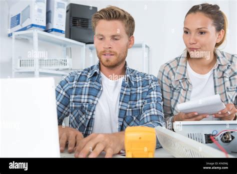 Female And Male Technician Working With Transistor In Laboratory Stock Photo Alamy