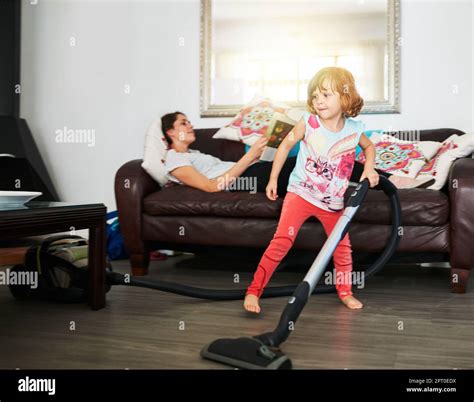 Shes Giving Mom A Break A Mother Lying Down On A Couch While Her