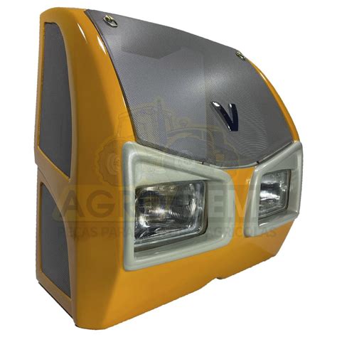 MASCARA FRONTAL DO RADIADOR COMPLETA GRADE EMBLEMA E FAROL S LA Agrodemp Tratores