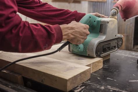 Using A Hand Held Sanding Machine Or Belt Sander To Level The Surface
