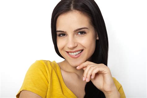 Close Up Candid Portrait Of Woman Laughing Against White Background