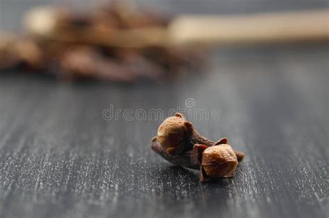 Dry Cloves In Wooden Scoop Isolated On White Background With Clipping