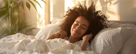 Premium Photo Young Woman Wakes Up In Bed Stretches And Smiles
