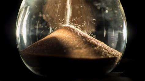 Premium Photo Hourglass Closeup On A Black Background