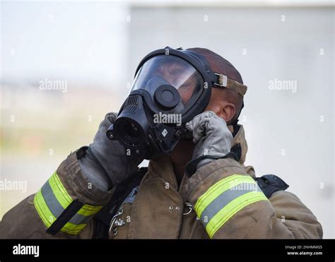 A Cadet Puts On His Firefighting Gear Before Entering The Simulated Structure Fire At Joint Base