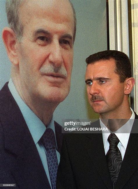 Bashar Al Assad Son Of Syrian President Hafez Al Assad Stands Under News Photo Getty Images