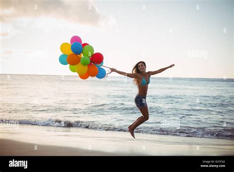 Woman Jumping With Balloon Stock Photo Alamy