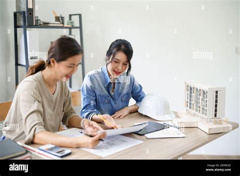 Concept Of Engineering Consulting Two Female Engineers Discussing
