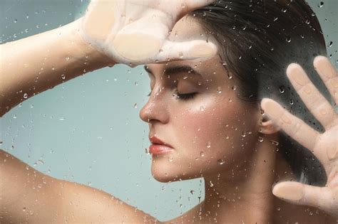 Premium Photo Portrait Of Sensual Woman Captured Through Wet Glass