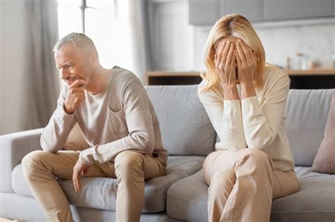 Mature Blonde Woman Crying After Quarrel With Husband Stock Image