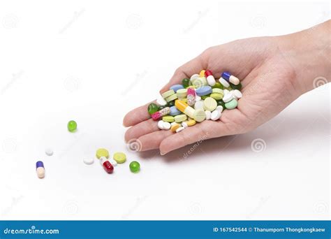 Close â€ Up Medicine On Handa Woman Holding Lots Of Pills And