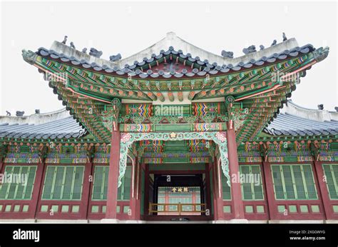 Colorful Korean Palace Entrance With Intricate Roof Details And Ornate
