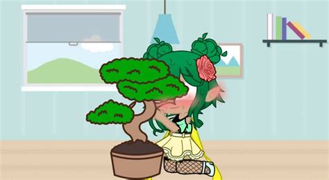 A Woman Holding A Potted Plant In Her Hand