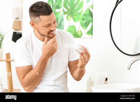 Man With Plastic Jaw Model At Home Stock Photo Alamy