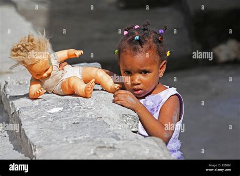 Creole Girl With Braided Hair Playing With Doll On The Island Santo