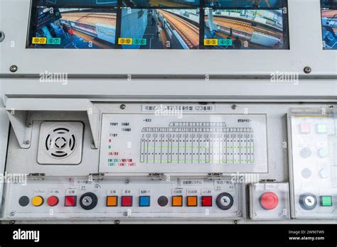Japanese Shinkansen Bullet Train Control Station On The Platform With Overhead Video Feeds