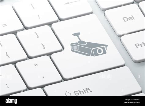 Safety Concept Cctv Camera On Computer Keyboard Background Stock Photo