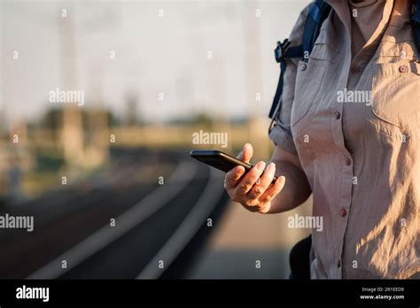 Woman Buying Online Railway Ticket To Train With Mobile App On Her