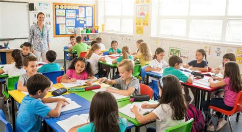 A Classroom Filled With Elementary Students Writing In Their Notebooks