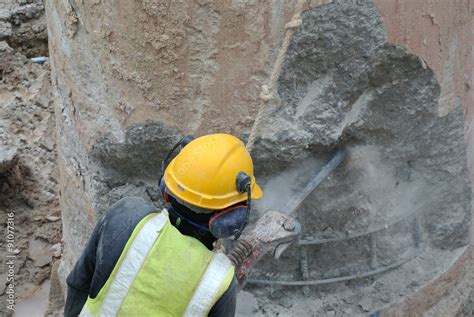 Construction Workers Using Mobile Concrete Hacker At The Construction Site Stock Photo Adobe Stock