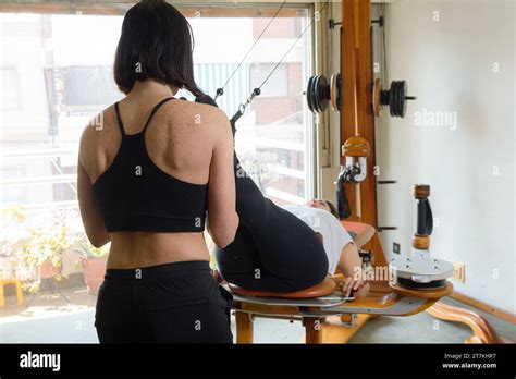 Unrecognizable Latin Woman Instructor Teaching Correct Leg Postures To