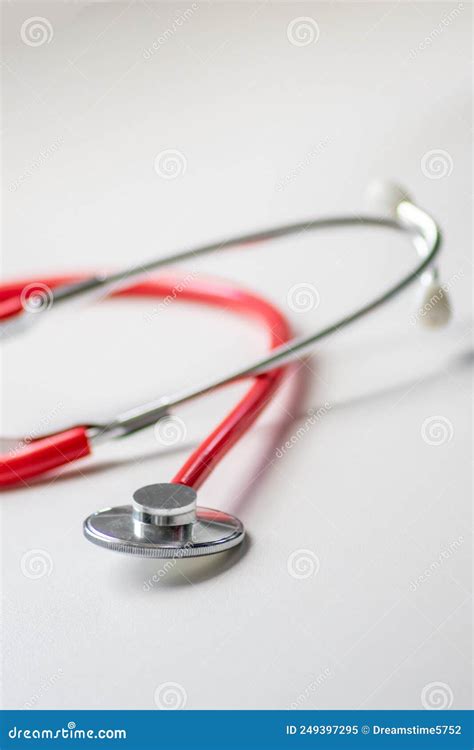 Red Stethoscope In Doctors Office For Professional Cardio Checkup And Healthy Heartbeat Pulse