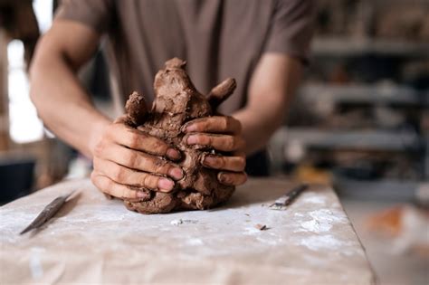 Free Photo Front View Man Clay Sculpting