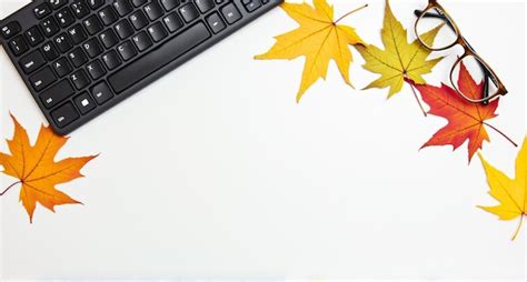 A Computer Keyboard With A Leaf On It And A Keyboard On The Left Side Premium Ai Generated Image