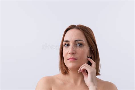 Beautiful Years Old Caucasian Woman With Short Red Hair And Hand Resting On Her Face Looking