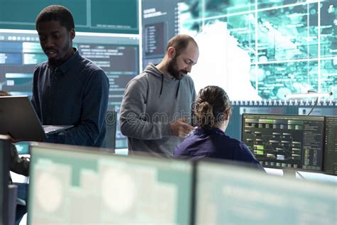 Governmental Hackers Working On Computer Network In High Tech Office Stock Image Image Of
